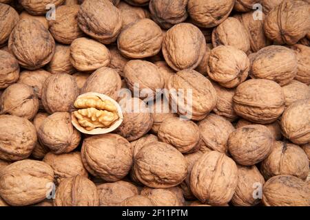 Bunch of walnuts whole and cracked Stock Photo - Alamy