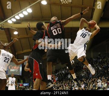 Villanova's Corey Fisher drives on North Carolina's Ty Lawson in a men ...