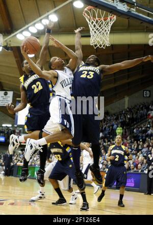 Villanova's Corey Fisher (10) tries to dribble around Georgetown's ...