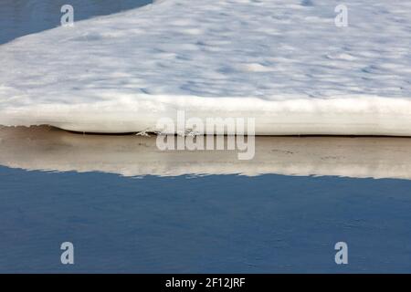 Ice forms along the Lake Michigan shore as People walk their dogs on a ...