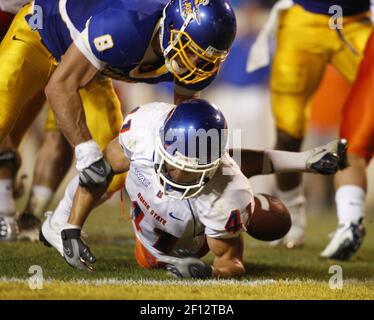Boise State's Ian Johnson (41) rushes against the defense of Fresno ...