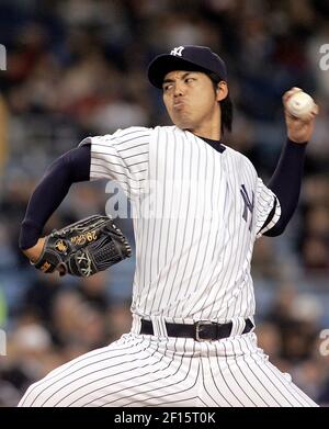 New York Yankees pitcher Kei Igawa of Japan smiles as he answers ...
