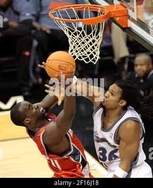 Charlotte Bobcats' Emeka Okafor (50) is fouled by Washington Wizards ...