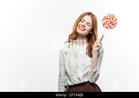 pretty woman with a round lollipop in her hands pleasure Stock Photo ...