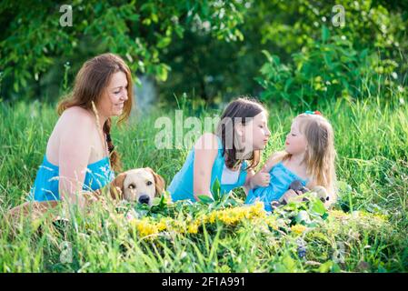 Mother, two daughters and dog Stock Photo - Alamy