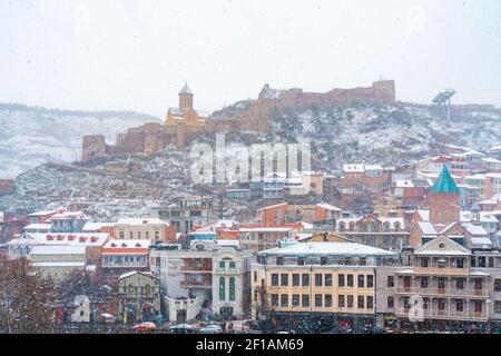 Tbilisi, Georgia - 24 February, 2021: Old Tbilisis with covered snow ...