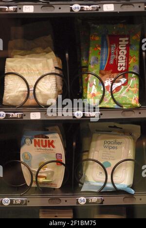 A "Nanny Caddy" vending machine dispenses baby items like diapers and ...