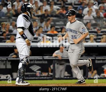 Toronto Blue Jays' Lyle Overbay, right, is congratulated by third base ...