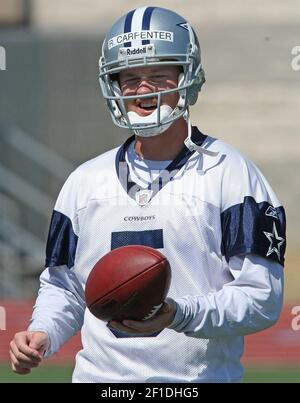 Dallas Cowboys quarterback Rudy Carpenter (11) is tackled by Miami ...