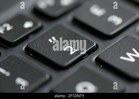 Number 2 and quote marks key on a laptop keyboard Stock Photo - Alamy