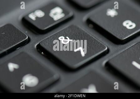 7 and ampersand key on a laptop keyboard Stock Photo - Alamy