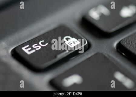 Escape and function lock key on a laptop keyboard Stock Photo - Alamy