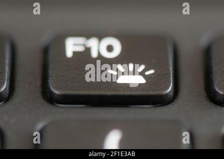 F10 and keyboard backlight key on a laptop keyboard Stock Photo - Alamy