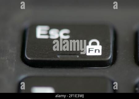 Escape and function lock key on a laptop keyboard Stock Photo - Alamy