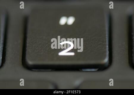Number 2 and quote marks key on a laptop keyboard Stock Photo - Alamy