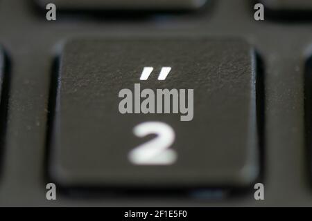 Number 2 and quote marks key on a laptop keyboard Stock Photo - Alamy
