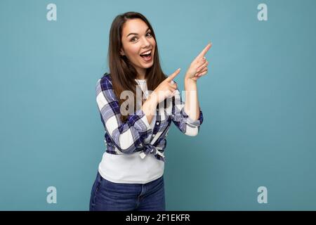 Photo of impressed young brunette lady watch tv wear red t-shirt ...