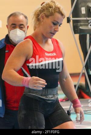 Weightlifter Lydia Valentin prepares to make her first attempt during ...