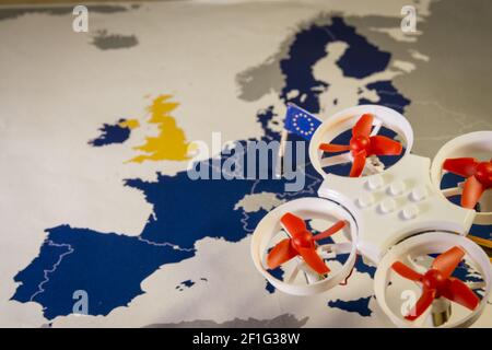 Mini drone flying over a EU map. European rules for drone aerial ...