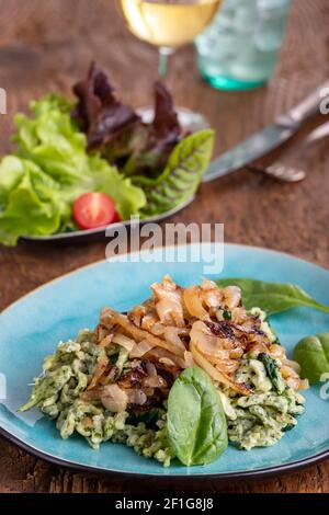 bavarian spinach spaetzle on wood Stock Photo - Alamy