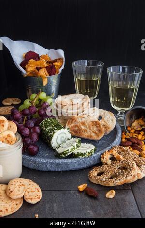 Assorted nibbles and wine Stock Photo - Alamy