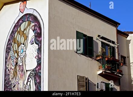 Painted wall art murals depicting historic scenes in downtown Muskogee ...