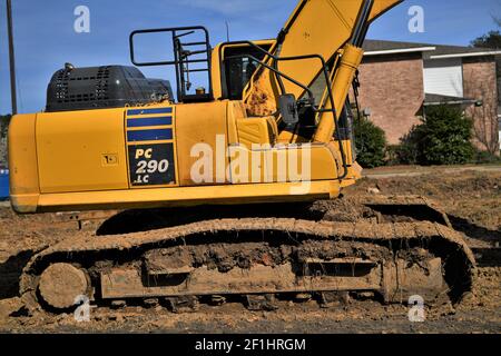 Komatsu and John Deere trackhoe construction equipment Stock Photo - Alamy