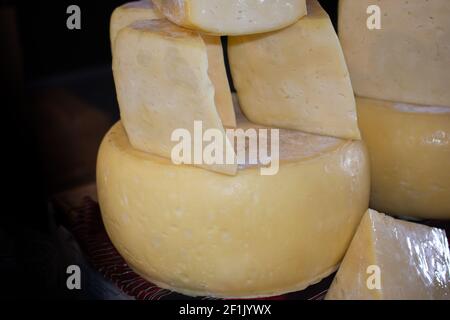 cuts of kashkaval or kasseri cheese for sale on the shelf Stock Photo ...