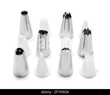 Different piping tips on white background Stock Photo - Alamy