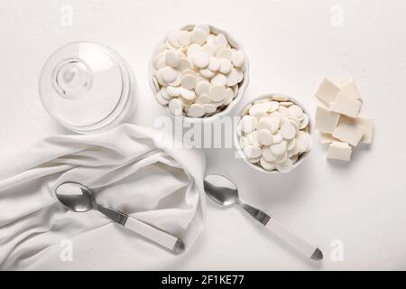 Bowls with chocolate drops on light background Stock Photo - Alamy