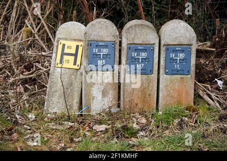 Concrete marker posts for water hydrant and HV in the UK Stock Photo ...