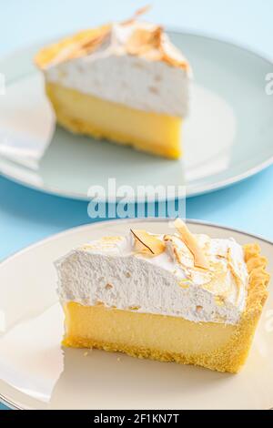 Plates with tasty coconut pie on color background Stock Photo - Alamy