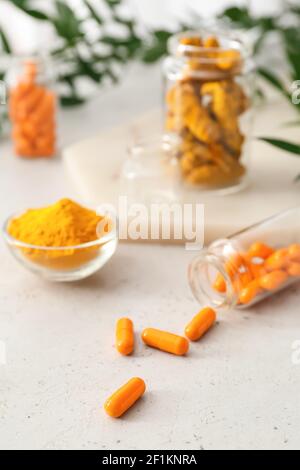 Roots, powder and turmeric pills - Curcuma longa. Space for text Stock ...
