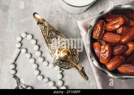 Aladdin lamp of wishes for Ramadan on blue background Stock Photo - Alamy