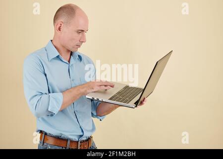 Serious mature male software developer in smart casualwear and ...