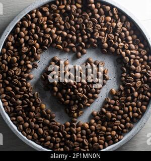 Heart made of coffee beans and instant powder with anise Stock Photo ...