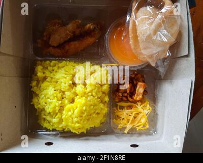 Indonesian ramadan rice lunch box called Aneka Nasi Kotak. An iftar ...