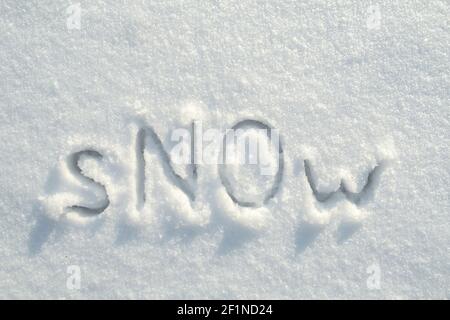 Winter word written on the snow surface Stock Photo - Alamy
