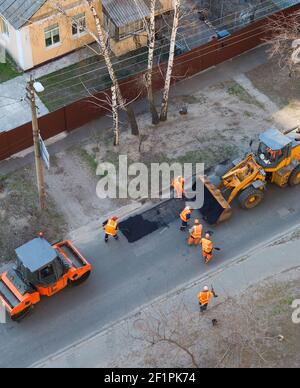 fixing road, asphalt, excavator people Stock Photo - Alamy