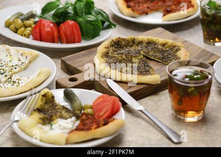 manakeesh, lebantine pizza, topping with zaatar(thyme), labneh(strained ...