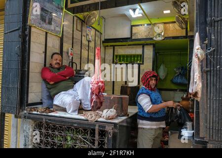 Kolkata, India - February 2021: A seller of lamb meat in his butcher ...