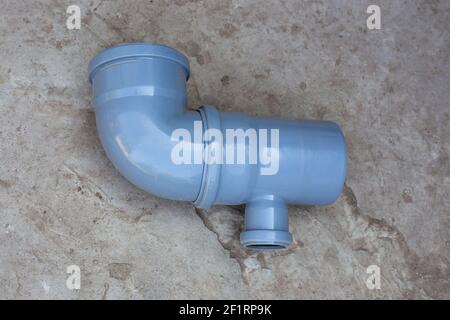 Junction of plastic sewer pipes. Sewage pipeline system of residential ...