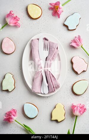 Easter table setting with floral decor on grey table. Elegance dinner ...