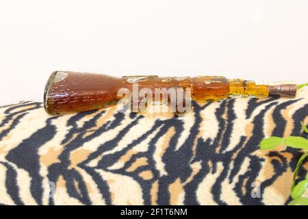 A bottle of alcohol in the form of AK-47 weapon on white background ...