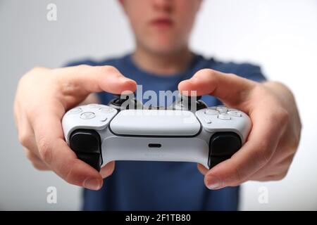 Teenager playing on a Playstation 5 or PS5 Stock Photo - Alamy