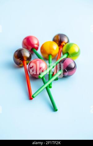 lollipops on a bright blue background Stock Photo - Alamy
