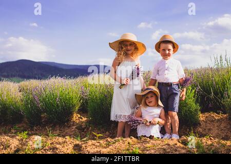 Three adorable kids, brother and two sisters Stock Photo - Alamy