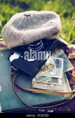 Album with vintage photos on wooden background Stock Photo - Alamy