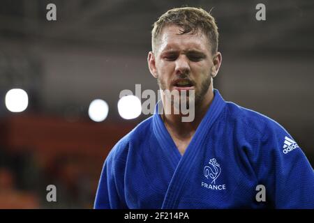France's Loic Pietri reacts after his defeat against Canada's Antoine ...
