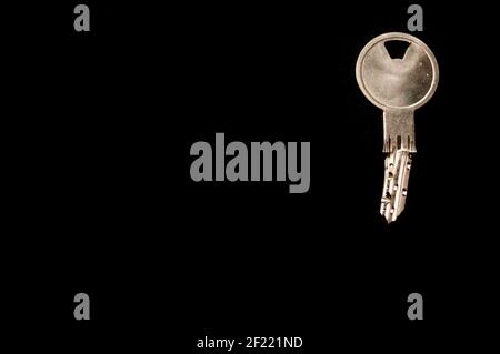Bent security key on black background. Bent from excessive use Stock ...